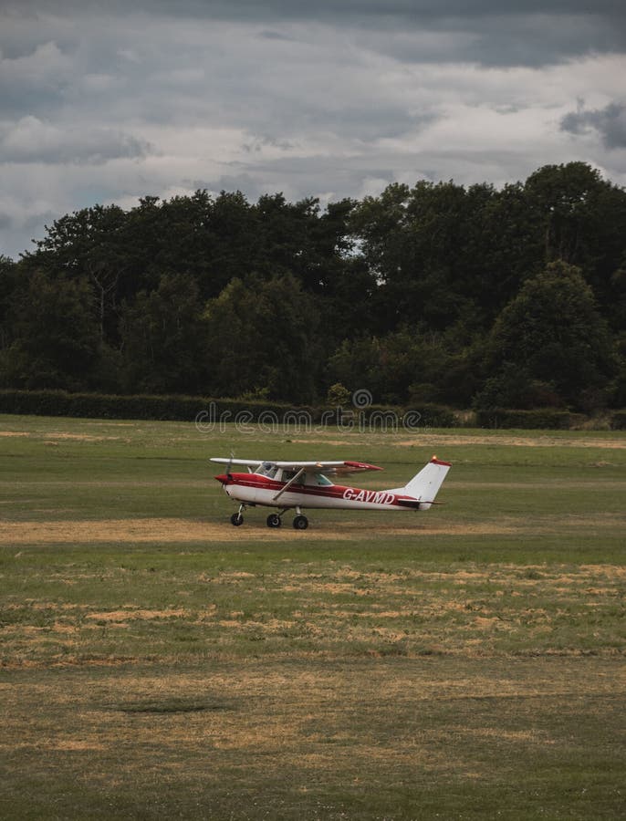 Light Aircraft Preparing for Flight from a Field, Vertical Editorial ...