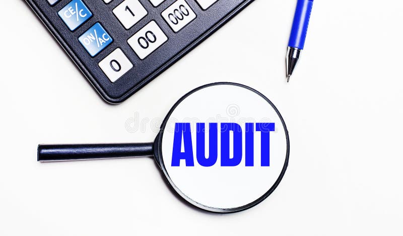 On a Light Background, a Black Calculator, a Blue Pen and a Magnifying ...