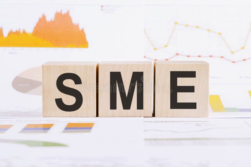 On a Light Background, Graphs, Diagrams and Wooden Cubes with the Word ...