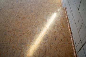 Light Beam on an Oriented Strand Board Subfloor. the First Leveling ...