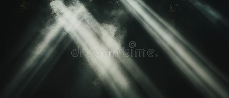 Light Beams Interacting with Smoke Create Dramatic Atmosphere Against a ...