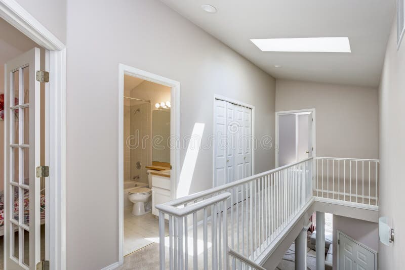 Beige Hallway with Staircase Leading Upstairs Stock Photo - Image of ...