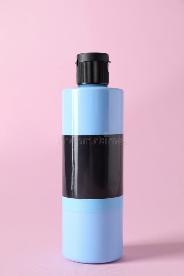 Light Blue Acrylic Paint in Bottle on Pink Background Stock Image ...