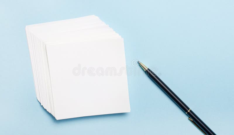 On a Light Blue Background, a Stack of Notes and a Pen. Template Stock ...