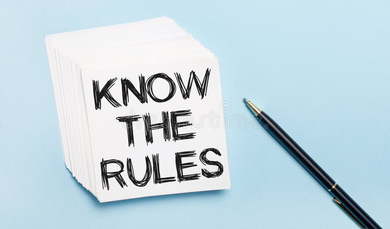 On a Light Blue Background, There is a Black Pen and a Stack of White ...