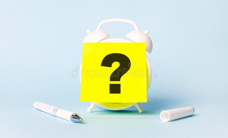 On a Light Blue Background - a White Handle and an Alarm Clock with a ...