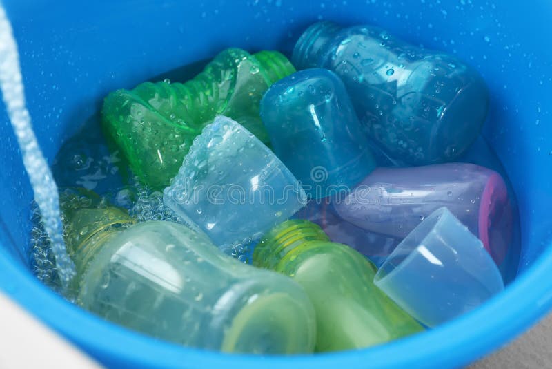 Light Blue Basin with Baby Bottles Under Stream of Water, Closeup Stock ...