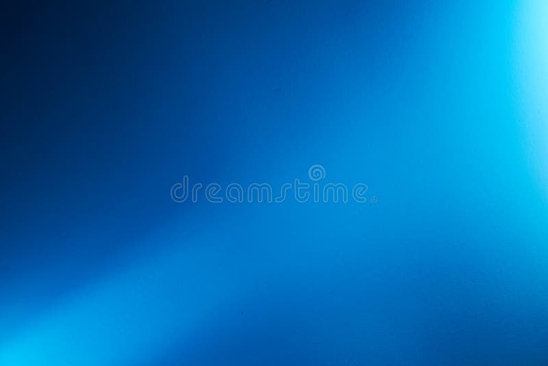 On a Light Blue and Blue Background a Light Diffused Beam of Light ...