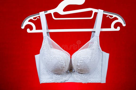 A Light Blue Bra Hanging on Red Background Stock Photo - Image of ...