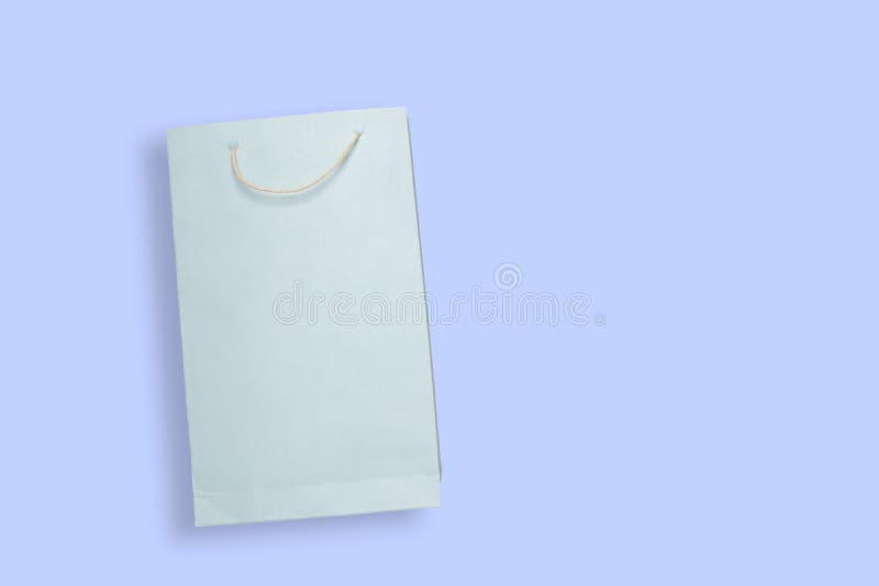 Light Blue Color Shopping Paper Bag on Blue Color Background with Copy ...