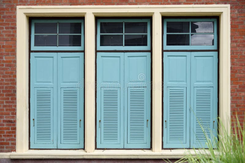 Light Blue Combination Windows on Brick Wall Stock Image - Image of ...