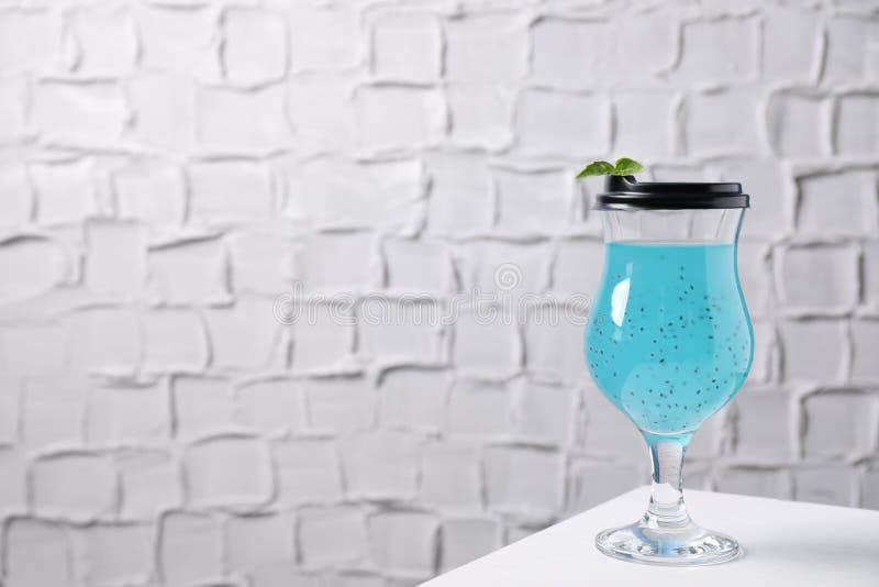 Light Blue Drink in Glass with Lid on White Table, Space for Text Stock ...