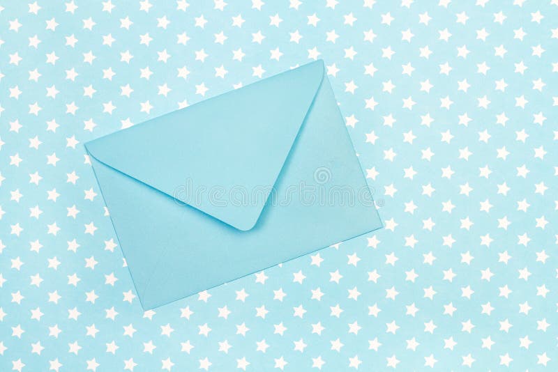 A Light Blue Envelope on a Light Blue with White Stars Background Stock ...