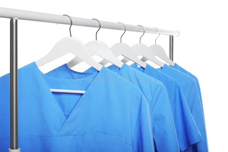 Light Blue Medical Uniforms on Rack Against White Background Stock ...