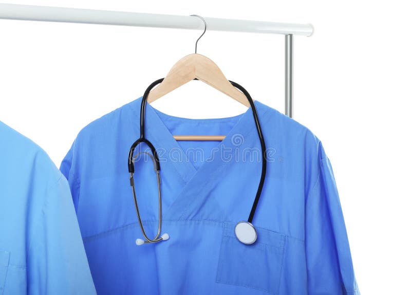Light Blue Medical Uniforms and Stethoscope on Rack Against White ...
