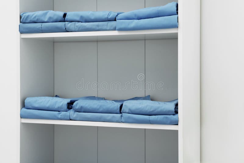 Light Blue Medical Uniforms on White Rack Stock Photo - Image of ...