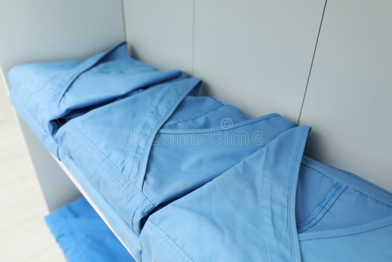 Light Blue Medical Uniforms on White Rack Stock Photo - Image of ...