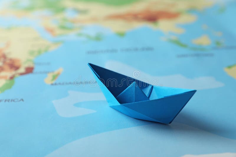 Light Blue Paper Boat on World Map, Closeup Stock Image - Image of ...