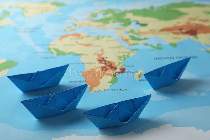 Light Blue Paper Boats on Map Stock Image - Image of color, marine ...