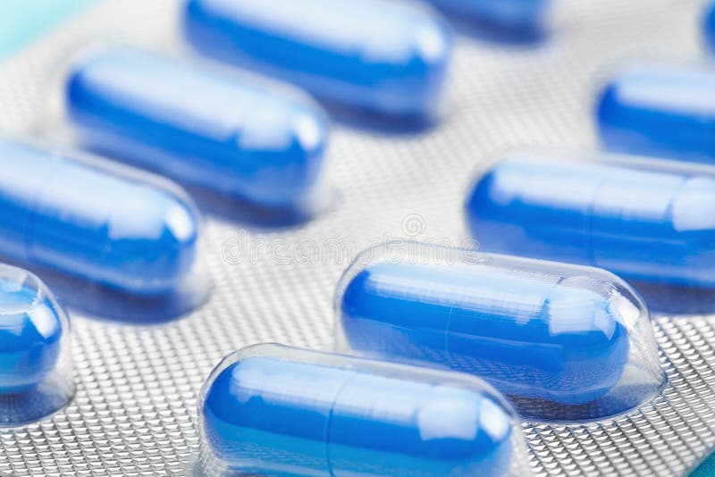 Light Blue Pill in Round Box on a Isolated White Background Stock Image ...