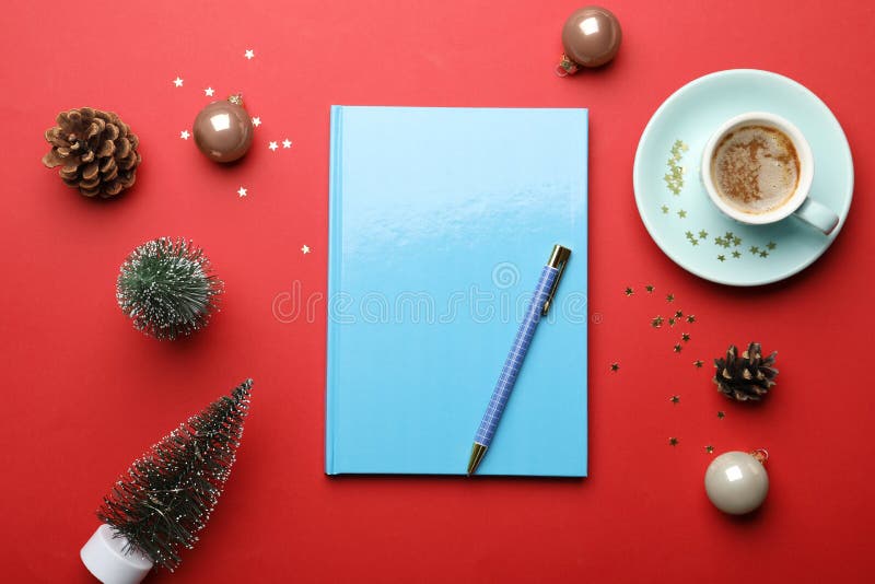 Light Blue Planner, Cup of Coffee and Christmas Decor on Red Background ...