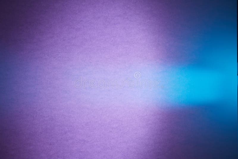 Light Blue Ray of Light Cuts through Blue Semi-blurred and Purple ...