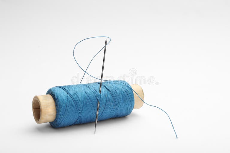 Light Blue Sewing Thread with Needle on White Background Stock Image ...