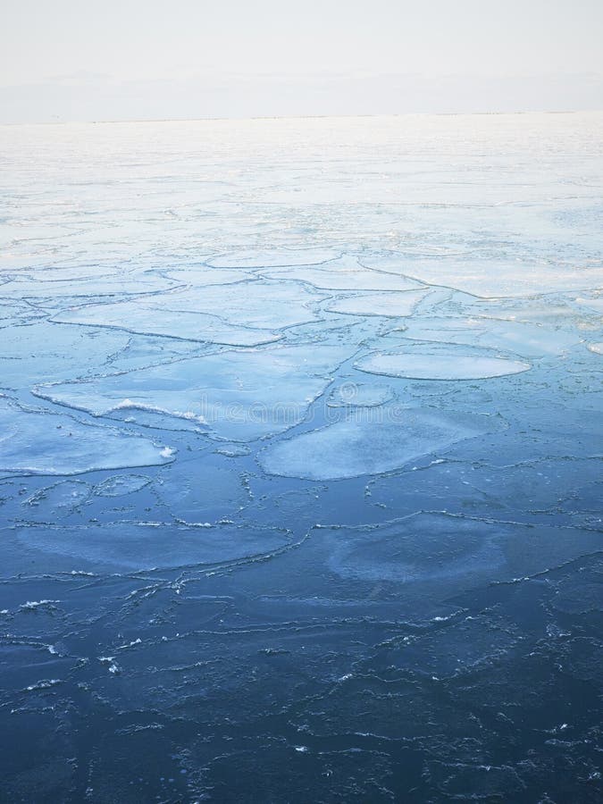Sheets of ice in ocean stock photo. Image of light, ocean - 129713120