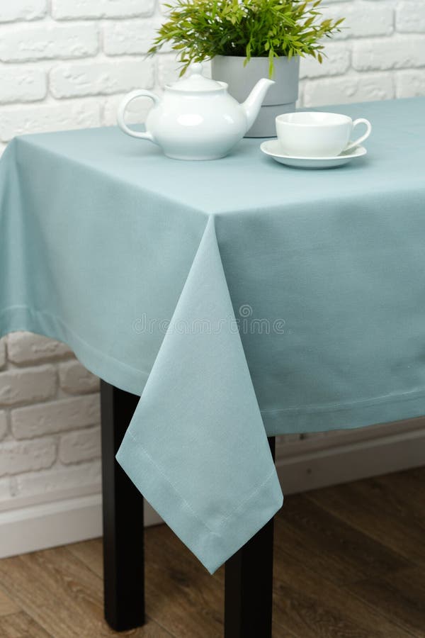 Light Blue Tablecloth on White Brick Wall Stock Photo - Image of modern ...