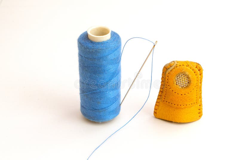 Quilting Essentials: Sewing Thread, Needle and Leather Thimble Stock ...