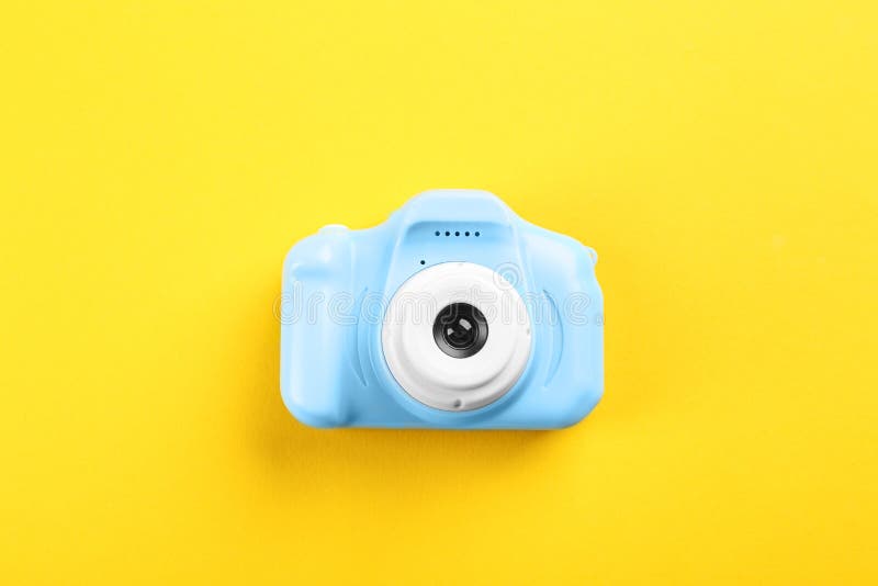Light Blue Toy Camera on Yellow Background Stock Photo - Image of ...