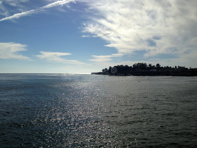 Light Blue Water Sea and Island on the Ocean Coast Under Blue Sky with ...