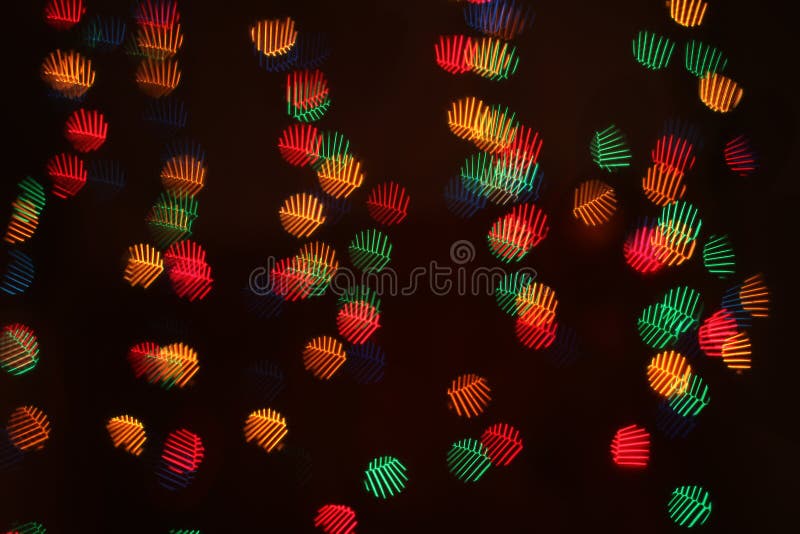 A Light Bokeh Pattern of Geometric Elements on a Dark Background Stock ...