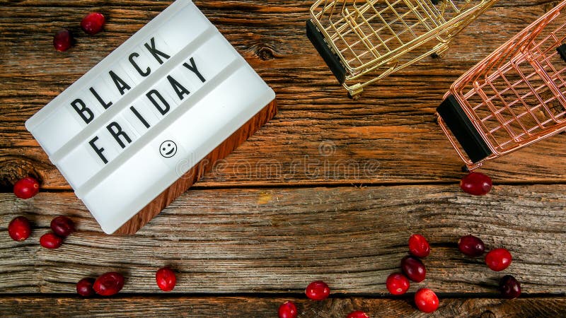 Light Box with Black Friday Text and Push Cart on Rustic Table Stock ...
