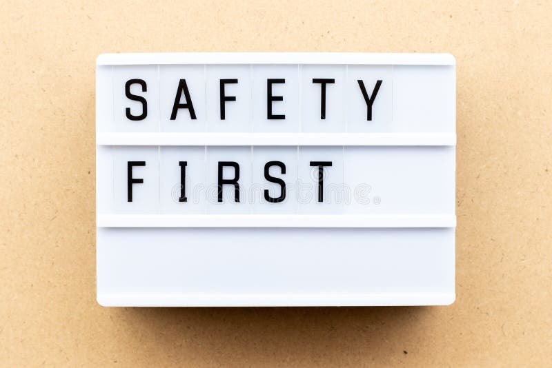 Light Box with Word Safety First on Wood Background Stock Photo - Image ...