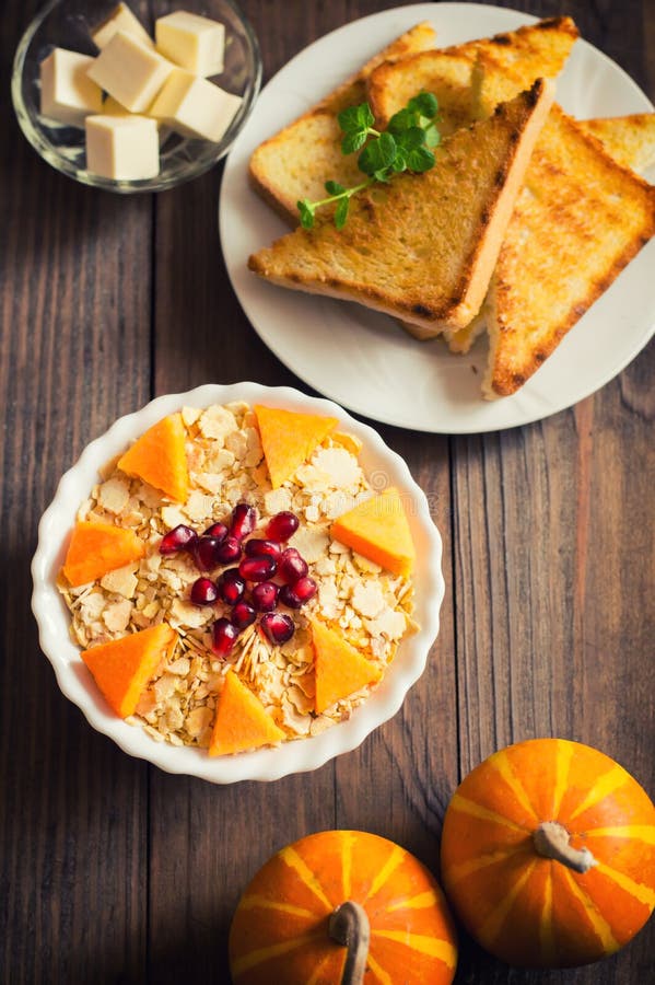 A Light Breakfast of Cereal, Jam, Milk, Biscuits and Fruit. Wooden ...