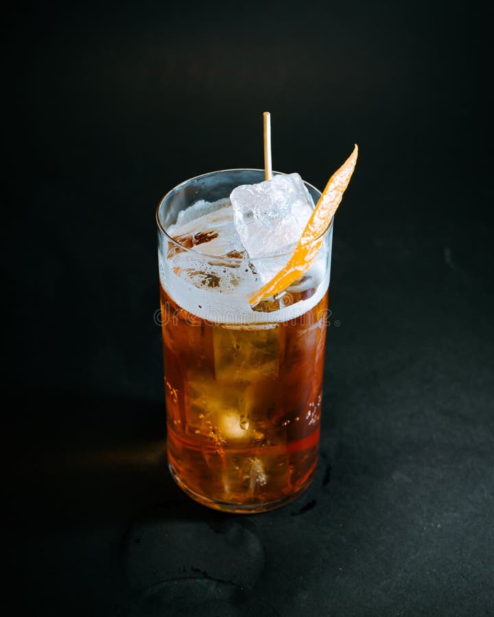Light Brown Colored Cocktail with Ice in it Served on a Table Stock ...
