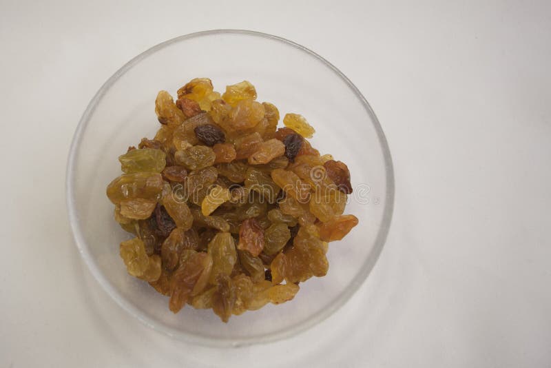 Light Brown Raisins in a Transparent Bowl on a White Background Stock ...