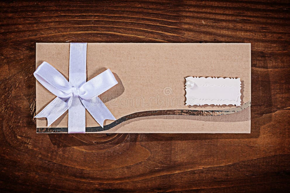 Light Brown Wedding Invitation Envelope on Old Wooden Board Stock Photo ...