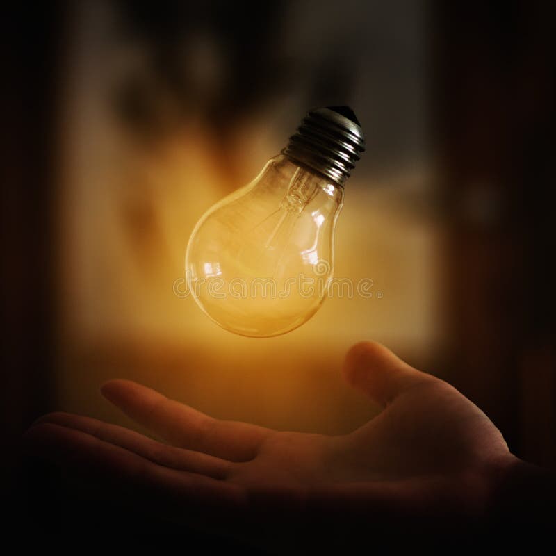 Light bulb above hand stock photo. Image of science, object - 93560686