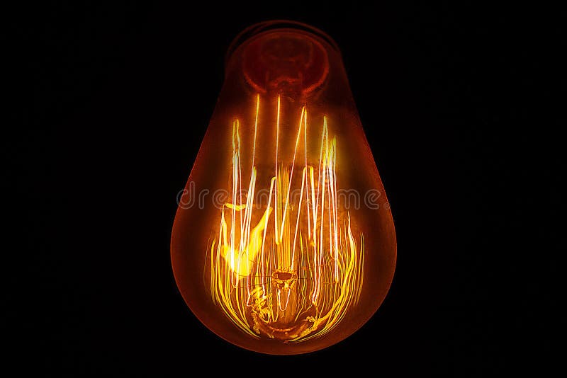 Light Bulb with Beautiful Filament on a Dark Background Stock Image ...