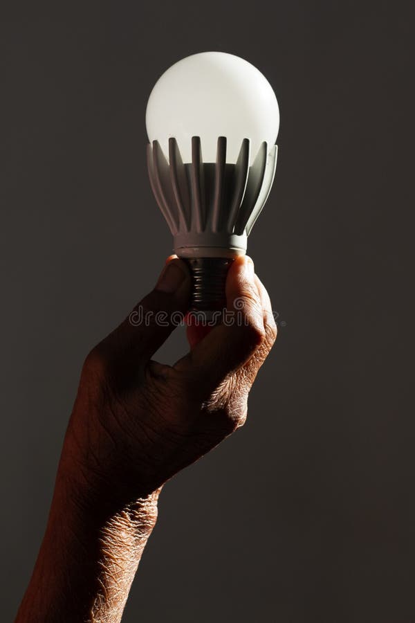 A Light Bulb Being Held in an Old Man S Stock Photo - Image of creative ...