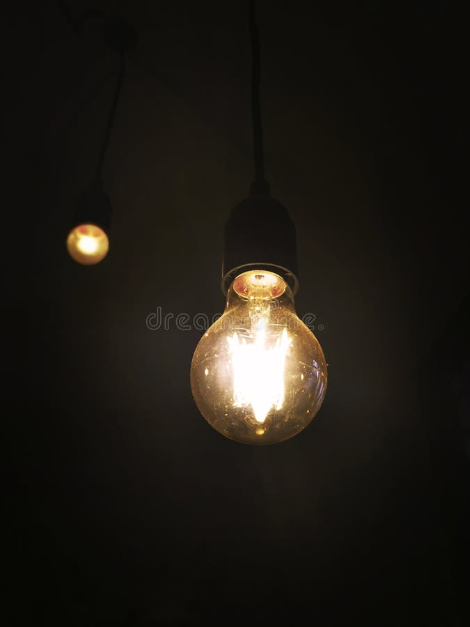 Light Bulb on Black Background Stock Photo - Image of glowing, light ...