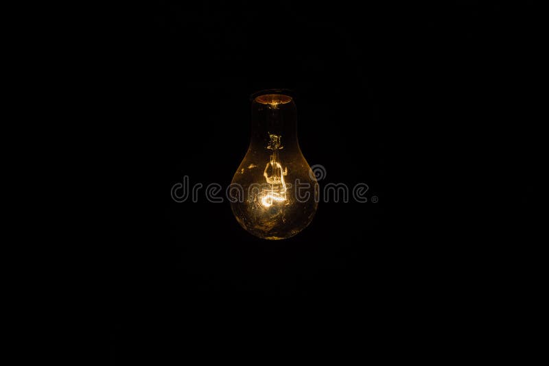 Light Bulb on Black Background Isolated Stock Photo - Image of isolated ...