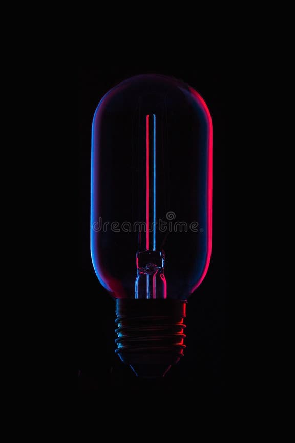 Light Bulb on Black Background Lit with Red and Blue Light Stock Image ...