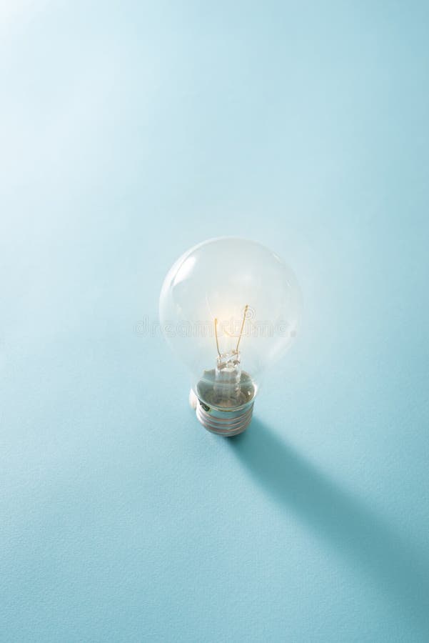 Light Bulb on Blue Background Stock Photo - Image of lamp, technology ...