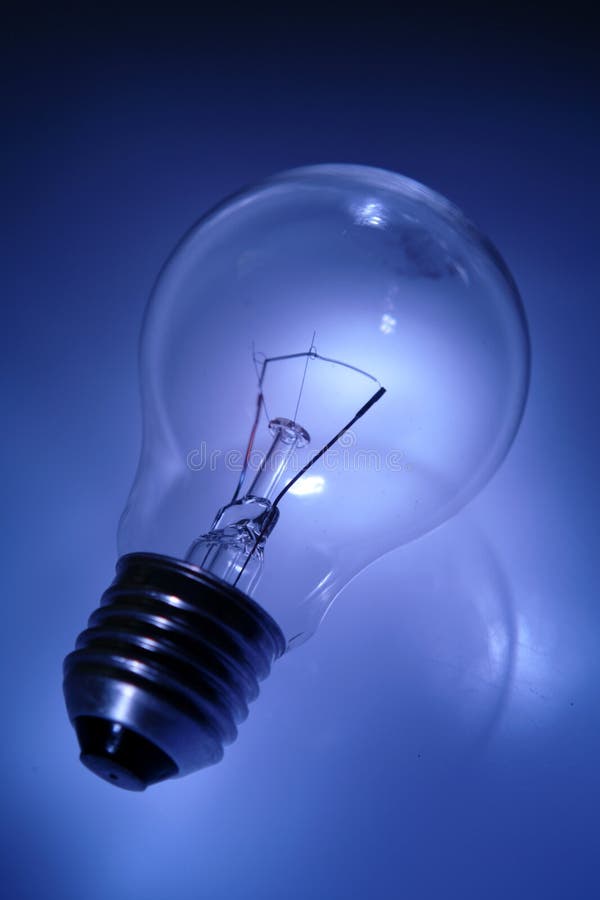 Light Bulb on Blue Background Stock Photo - Image of design, background ...