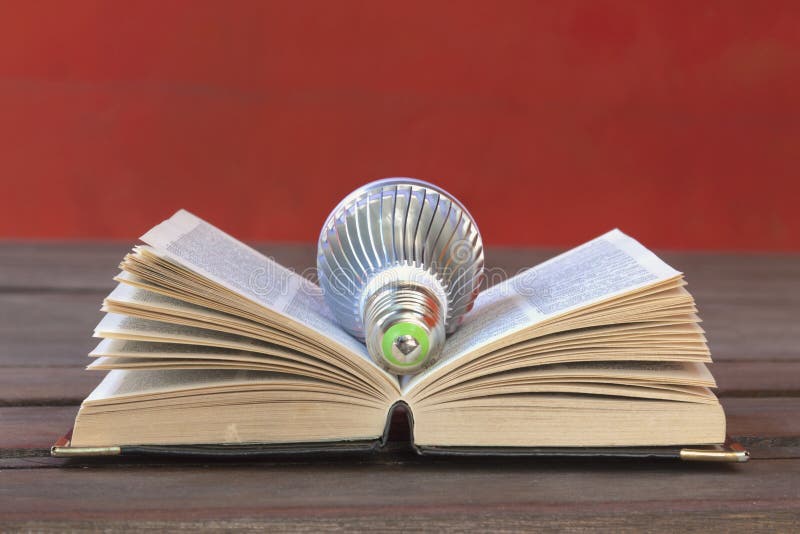 Light bulb on the book stock image. Image of lightbulb - 53019305