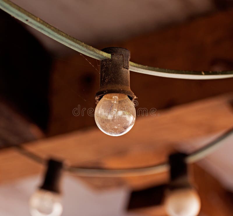 Light Bulb on Cable Against Brick Wall Stock Photo - Image of lighting ...