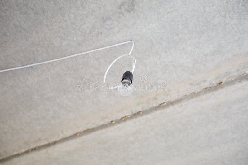Light Bulb on the Ceiling. Lonely Light Bulb and Wire Sticking Out of ...